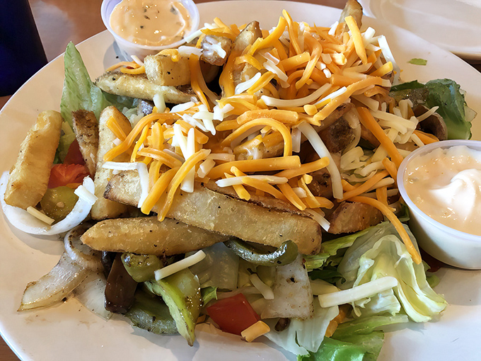 The Fire Pit Salad proves that "eating healthy" and "absolutely delicious" aren't mutually exclusive concepts. Those cheese-topped fries aren't exactly hiding, though.