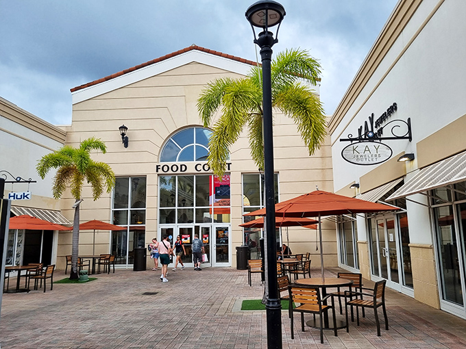 The Food Court: where shopping warriors refuel before diving back into the retail fray. Diet plans come here to die.