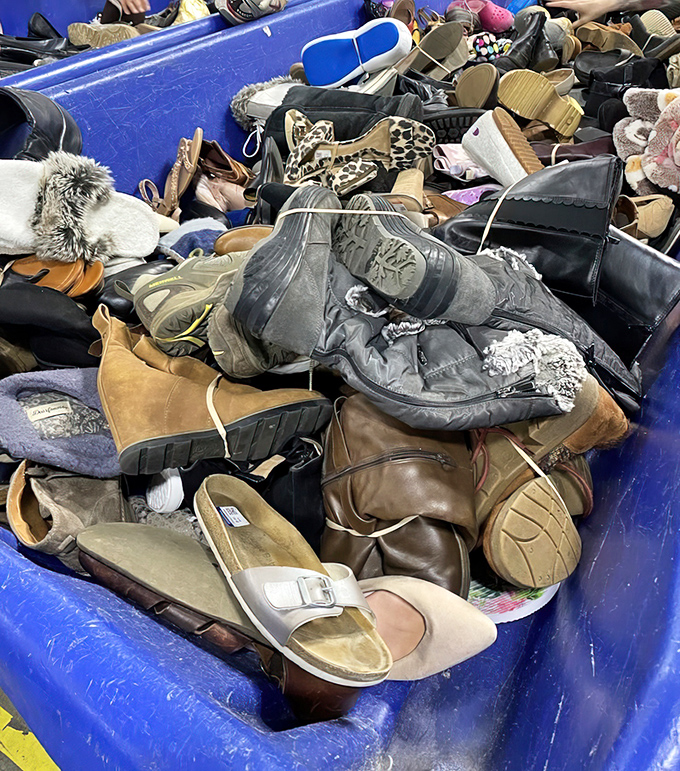Footwear archaeology at its finest! Barely-worn designer boots nestle against practical hiking shoes, all waiting for their Cinderella moment. 