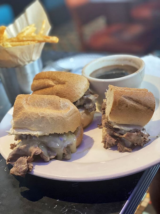 The French dip arrives on a sesame roll, ready to take a luxurious swim in au jus.