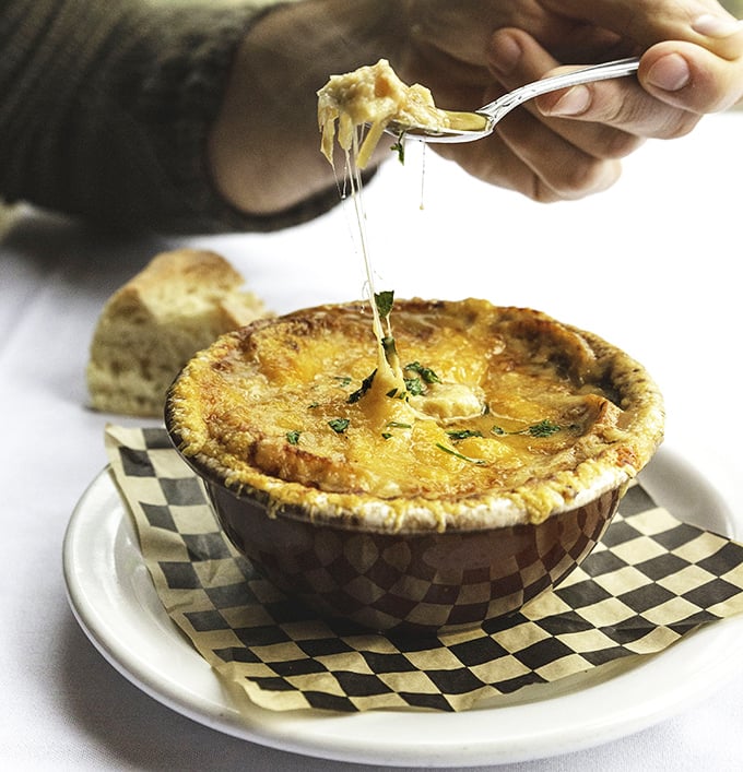 Cheese stretching like a suspension bridge over this French onion soup&mdash;a warm hug in a bowl for Portland's famously rainy days.