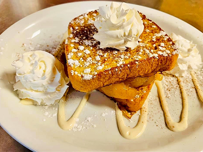 French toast that's dressed for success&mdash;powdered sugar, whipped cream, and a drizzle that makes you forget about your so-called "diet."