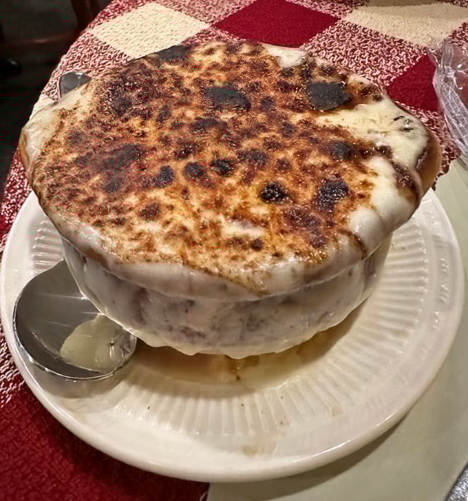 French onion soup with a cheese cap so perfectly browned it deserves its own standing ovation. Spoon-breaking satisfaction guaranteed.