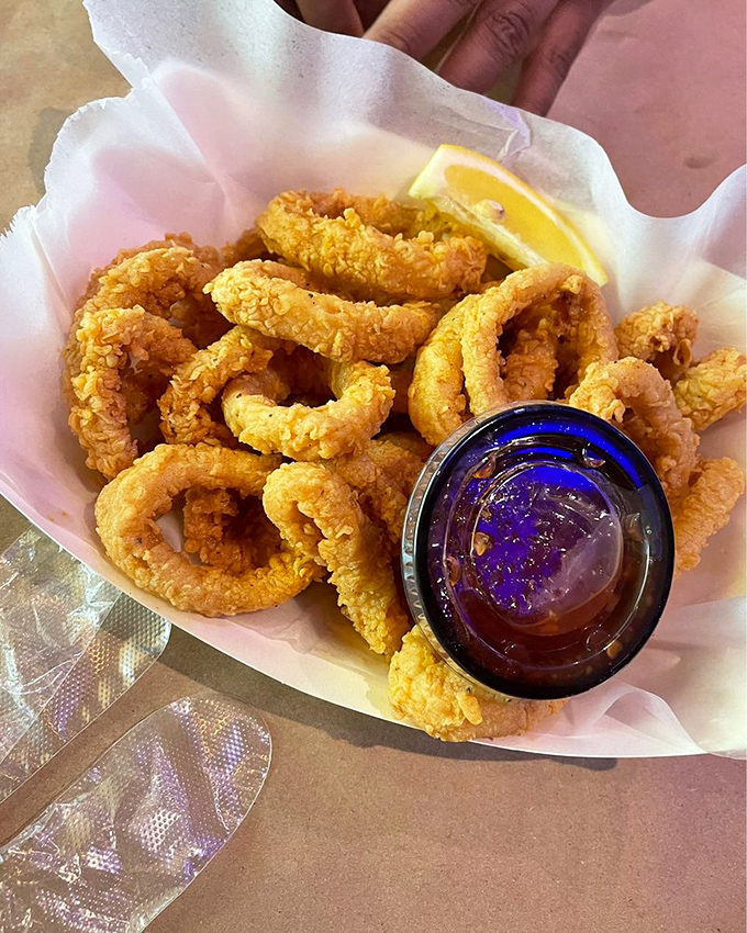 Crispy calamari rings with dipping sauce &ndash; the seafood equivalent of onion rings but with bragging rights. "Yes, I'm eating tentacles and loving every bite."