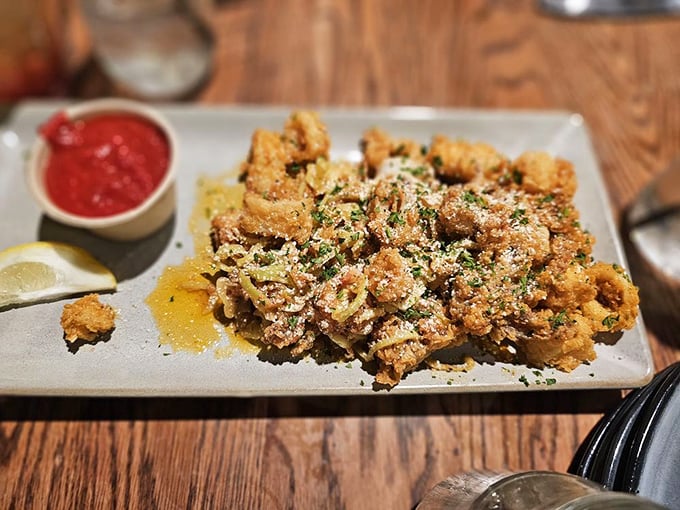 Fried calamari so perfectly crisp, it makes you wonder why we ever bothered with onion rings. The sprinkle of parmesan is the chef's kiss.