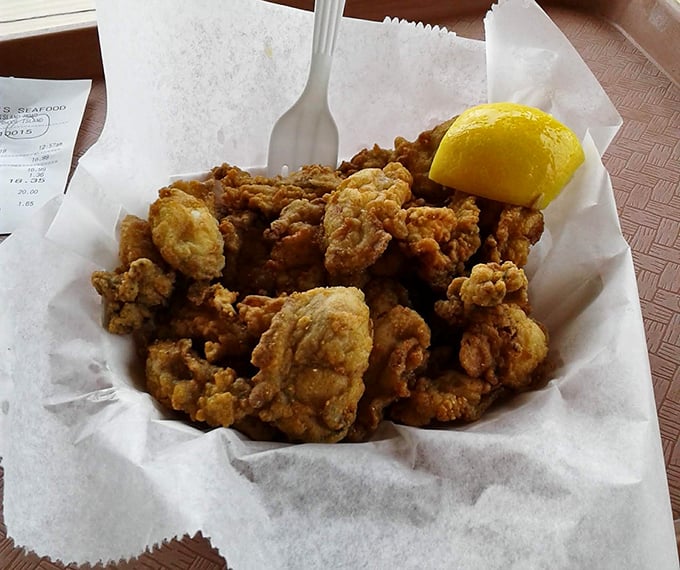 These fried oysters aren't just food—they're little golden nuggets of oceanic joy. That lemon wedge isn't decoration; it's the perfect dance partner.