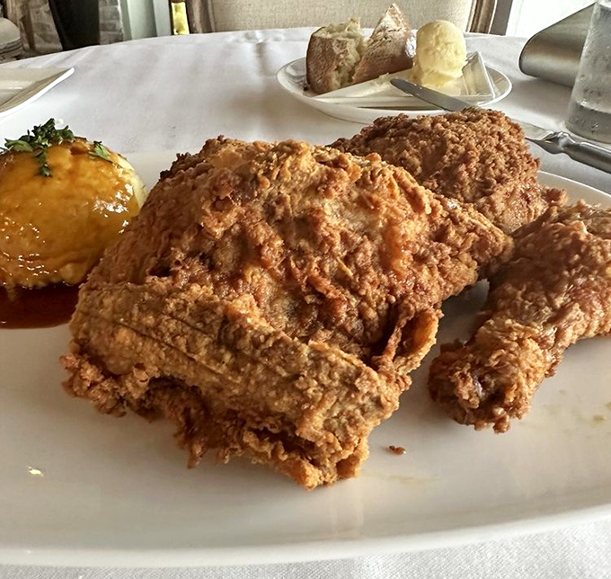 Fried chicken so perfectly golden it deserves its own trophy, with a side of something delicious that's about to disappear quickly.