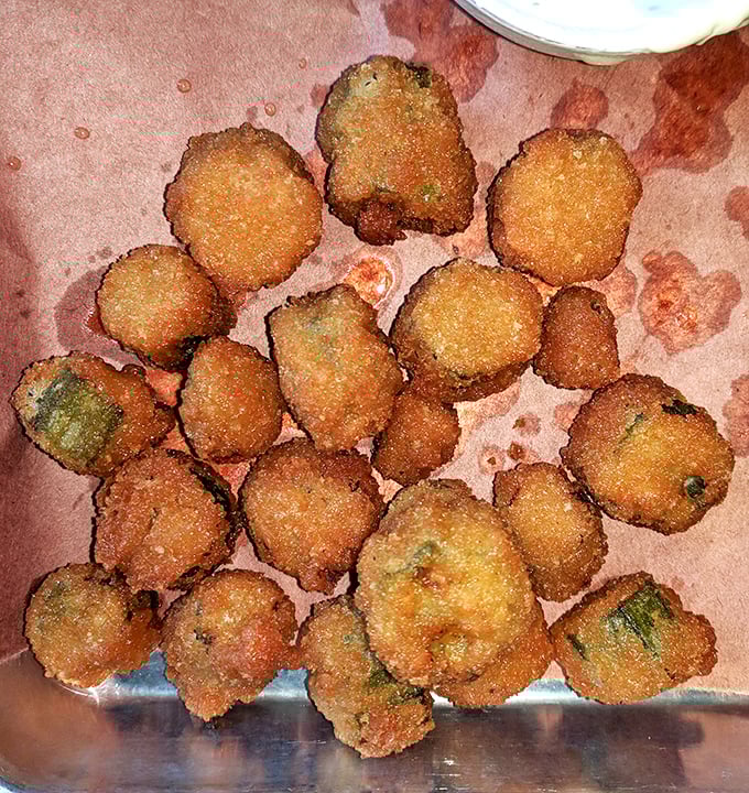 Fried okra: the unsung hero of barbecue sides. Crispy, golden nuggets that even okra skeptics will fight over like long-lost treasure.