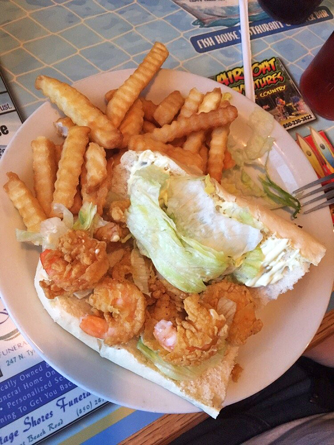 This fried shrimp po'boy isn't just a sandwich&mdash;it's an edible love poem to the Gulf. Crispy, tender, and generous enough to require a tactical eating strategy.
