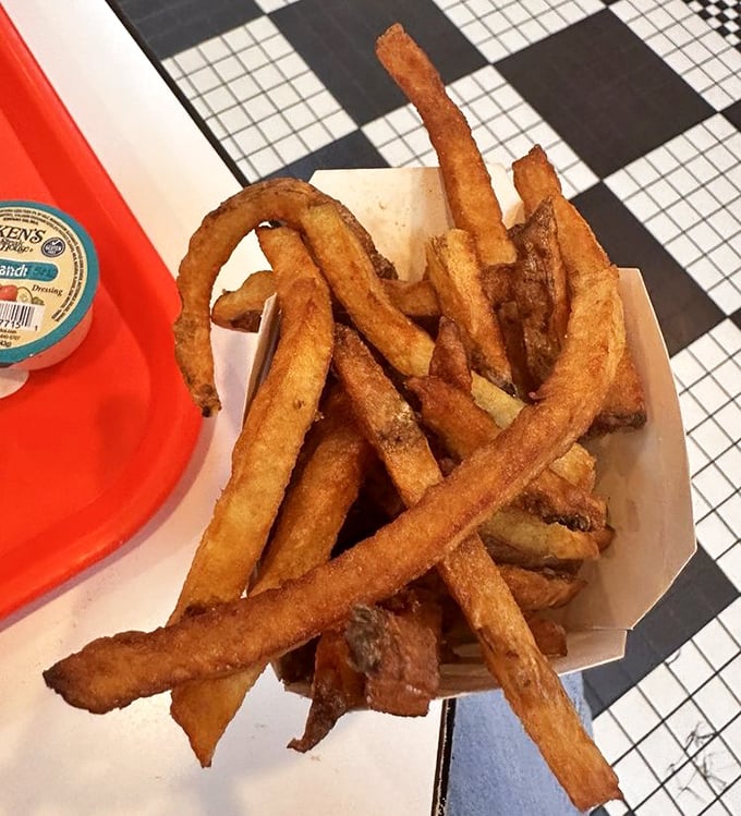 French frys with a "y" because they're too special for conventional spelling&mdash;hand-cut, golden-brown monuments to potato perfection that put frozen imposters to shame.