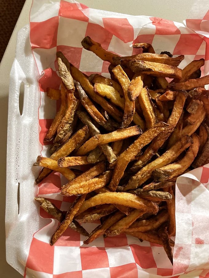 Hand-cut fries that achieve the golden trifecta: crispy exterior, fluffy interior, and just enough salt to make you smile.