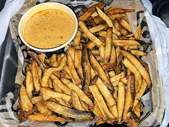 Golden fries with comeback sauce demonstrate that sometimes the best accompaniments steal the spotlight from the main act.