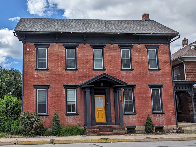 This handsome brick building with its sunny yellow door says "come in" more invitingly than any neon "OPEN" sign ever could.