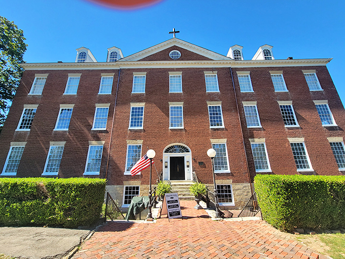 This stately brick building houses treasures of Kentucky's past. Its symmetrical windows and American flag speak to the town's appreciation for both beauty and heritage.