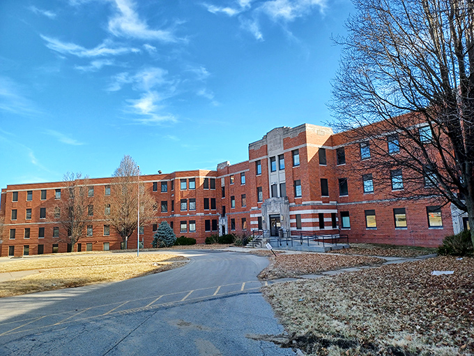 The historic Glore Psychiatric Museum building stands as a testament to architectural preservation. Its brick facade tells stories of a different era, much like your vinyl record collection.