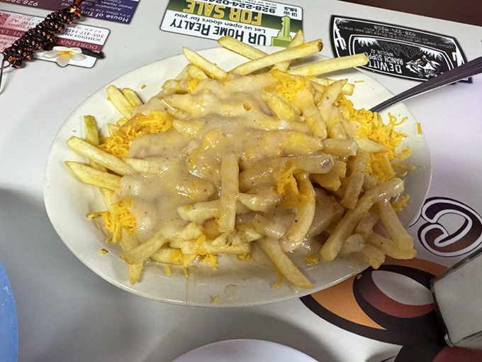 Gravy fries that laugh in the face of diet plans. Crispy potatoes smothered in gravy and cheese – the kind of indulgence that makes cardiologists wince and taste buds sing.