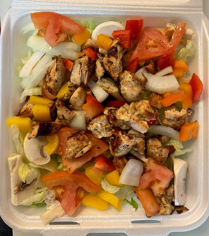 A grilled chicken salad that proves even the non-burger items here get the star treatment they deserve.