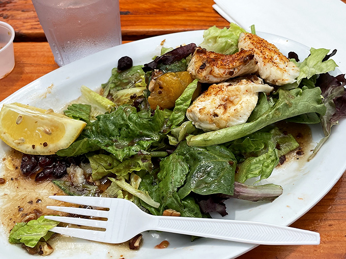 A simple green salad elevated to star status with perfectly grilled halibut&mdash;proof that sometimes the best seafood needs minimal interference.