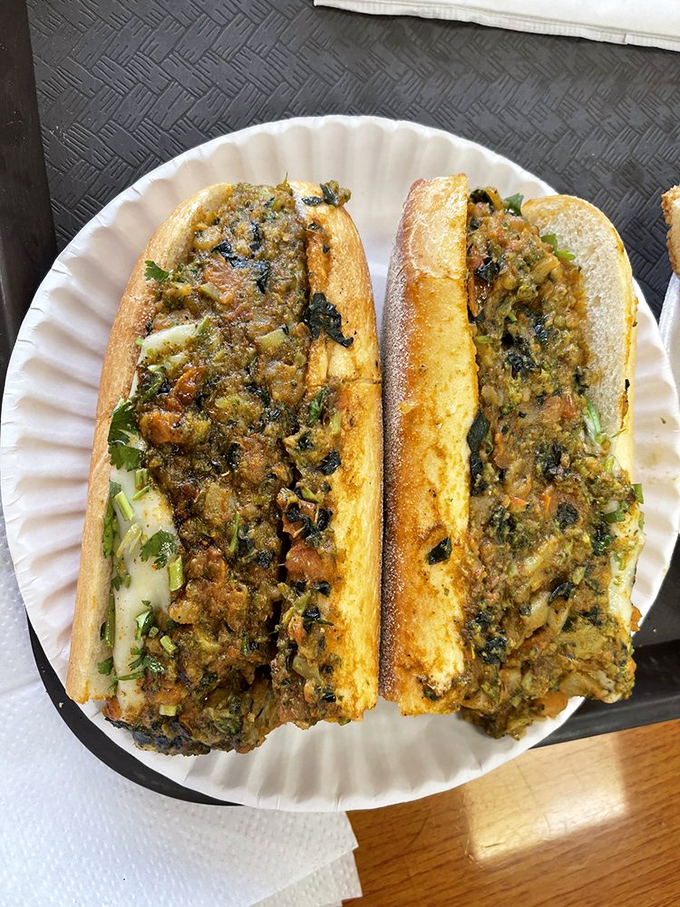 This isn't just a sandwich, it's architecture &ndash; layers of fresh veggies and melted cheese create a masterpiece of flavor and texture.