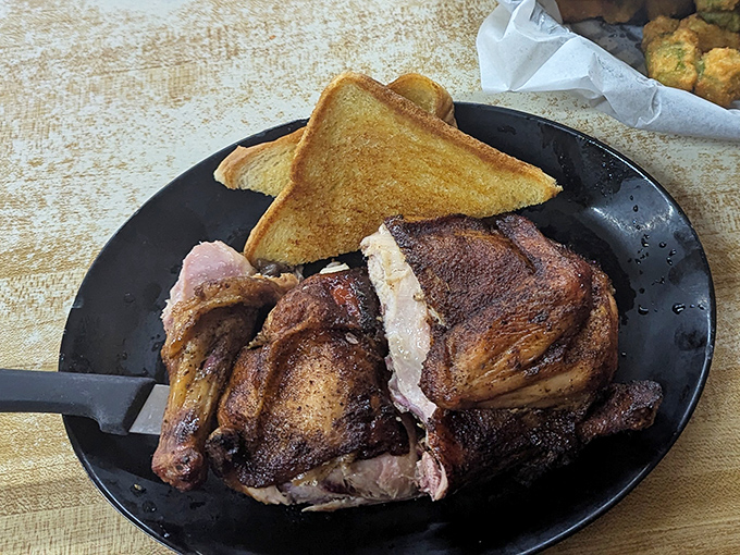 Half a smoked chicken that proves poultry deserves its place in the BBQ pantheon. That mahogany skin is hiding treasures beneath.