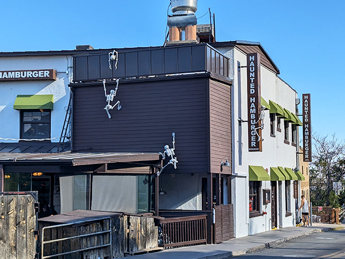 The Haunted Hamburger lives up to its spooky reputation with skeleton crew members who are literally hanging around outside.