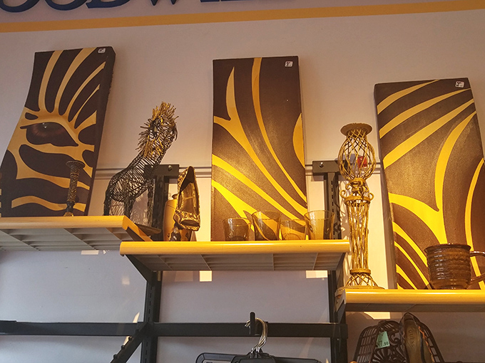 Abstract art meets practical decor in this carefully curated display, where zebra-print canvases add drama to an already eclectic collection of home accessories.