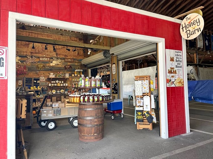 The Honey Barn stands like a sweet oasis, its wooden barrel sentinel guarding liquid gold harvested from Florida's flowering bounty.