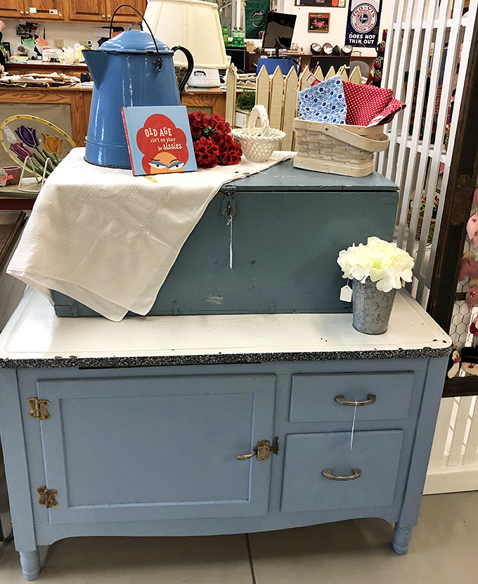 This blue Hoosier cabinet isn't just furniture; it's a time machine to grandma's kitchen where cookies appeared as if by magic.