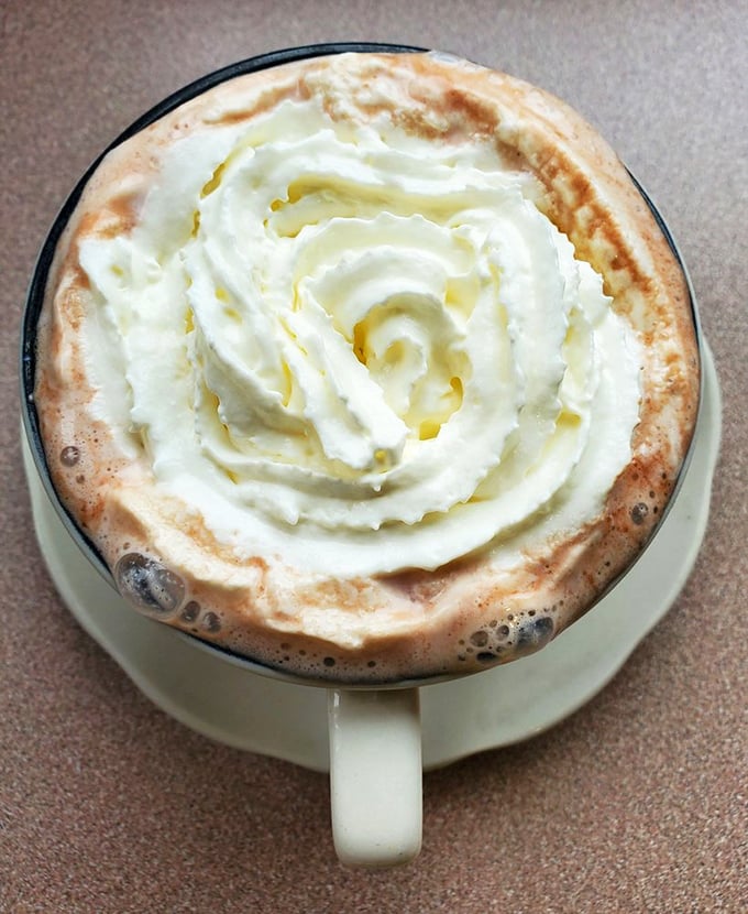 Hot chocolate that doesn't come from a packet, topped with a whipped cream spiral that deserves its own Instagram account.