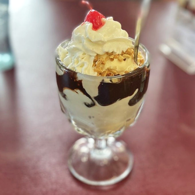 Hot fudge cascading down vanilla peaks like chocolate lava. This sundae doesn't just satisfy a sweet tooth&mdash;it throws a party for every taste bud.