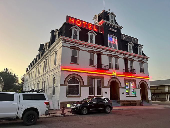 Hotel Metlen's neon sign glows like a beacon from another era, promising weary travelers the same warm Montana welcome it's offered for generations.