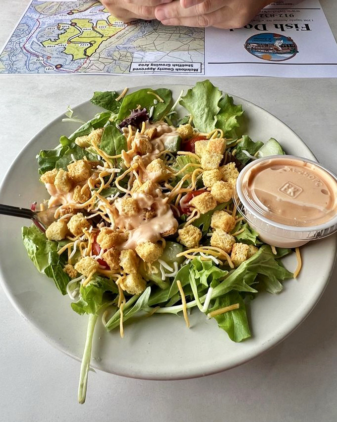 Not just a token green thing! This fresh salad with shredded cheese and house dressing offers a welcome counterpoint to seafood indulgence.