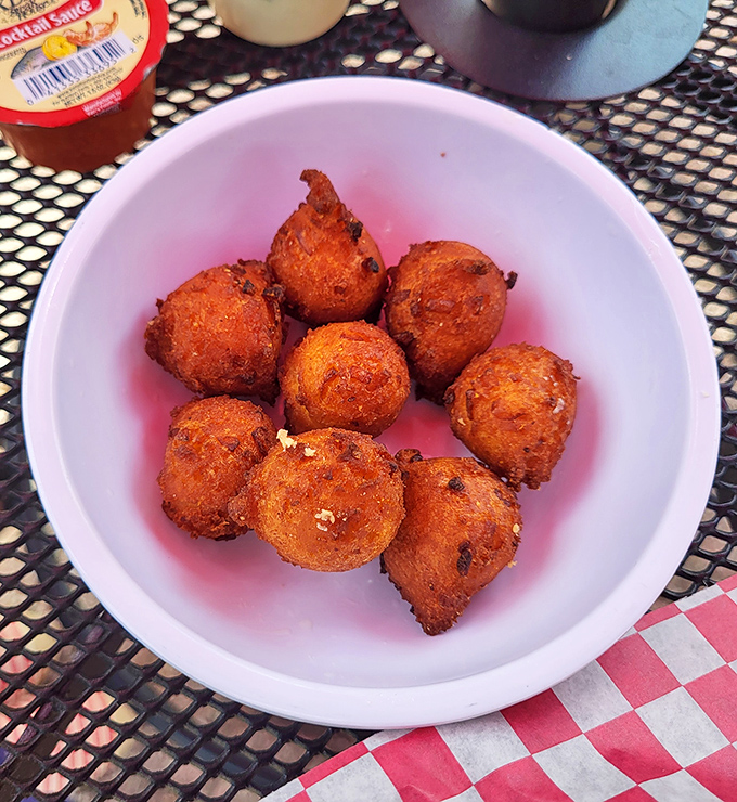 Hushpuppies so perfectly golden they deserve their own trophy. These crispy orbs of cornmeal delight are dangerously addictive.