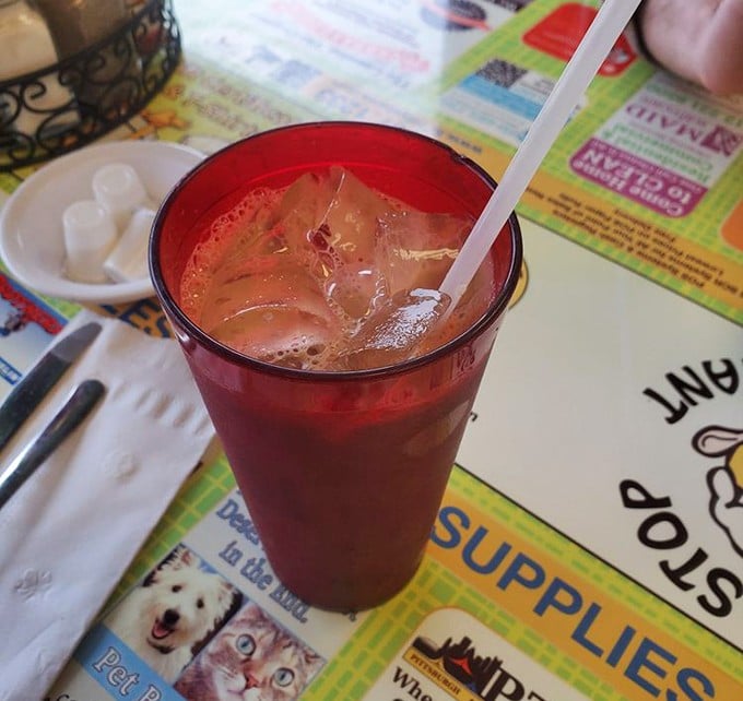 The iced coffee that launched a thousand productive mornings. In that ruby-red glass lies the perfect balance of caffeine, chill, and Pittsburgh breakfast tradition.