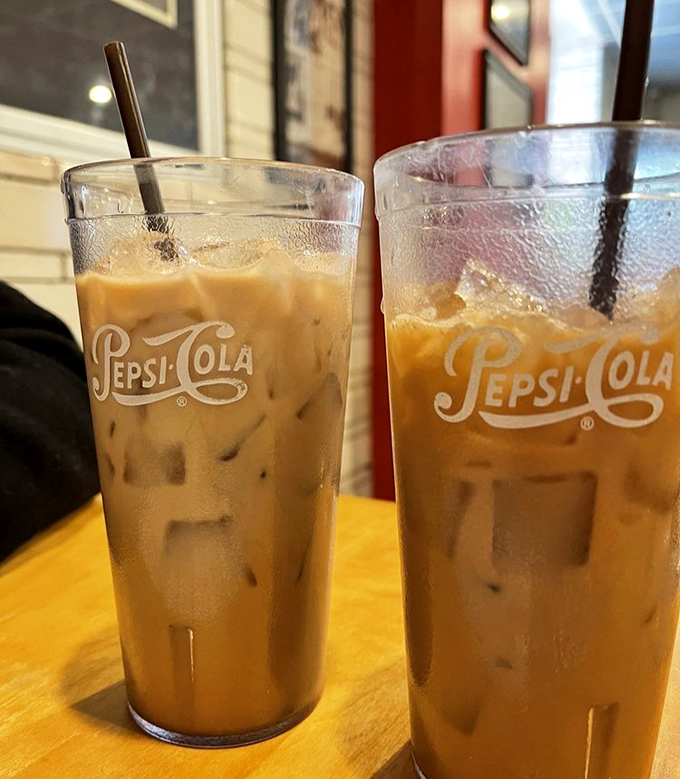 Iced coffee served in vintage Pepsi glasses—because sometimes the vessel matters as much as what's inside it. Nostalgia never tasted so refreshing.