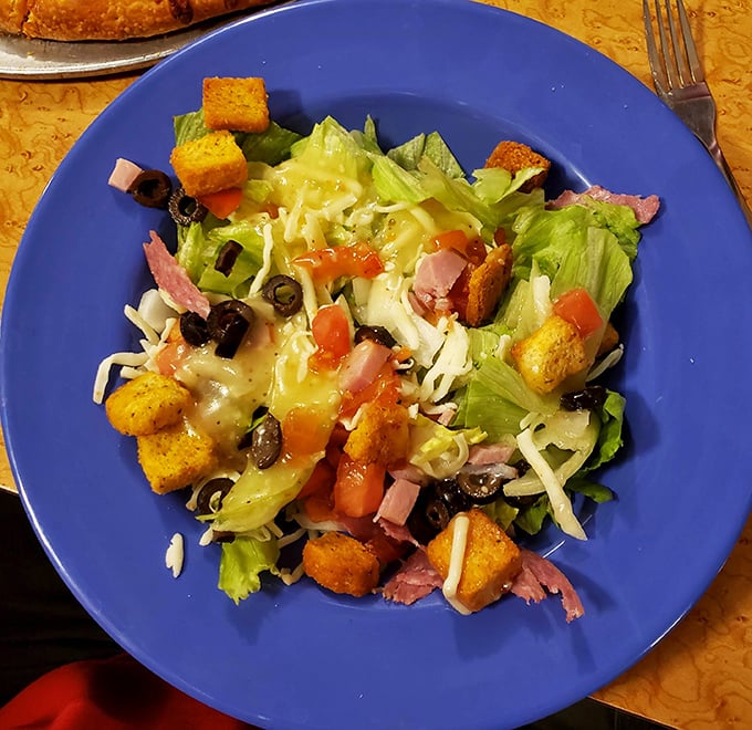 A salad that does time with ham, cheese, and croutons. Even the most dedicated pizza lovers occasionally need some greens in their sentence.