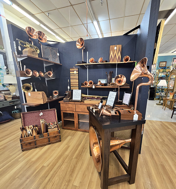 The brass section of this antique orchestra gleams under fluorescent lights, each horn waiting for its chance to play again. Music history you can touch!
