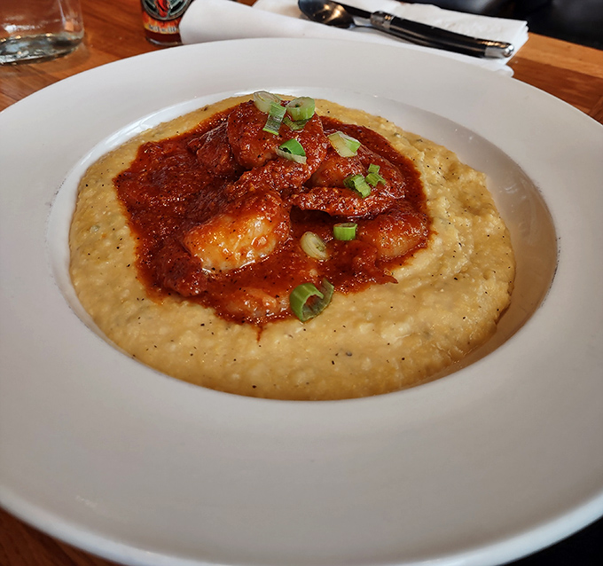 Shrimp and grits looking like a masterpiece painted with butter, spice, and Southern know-how.