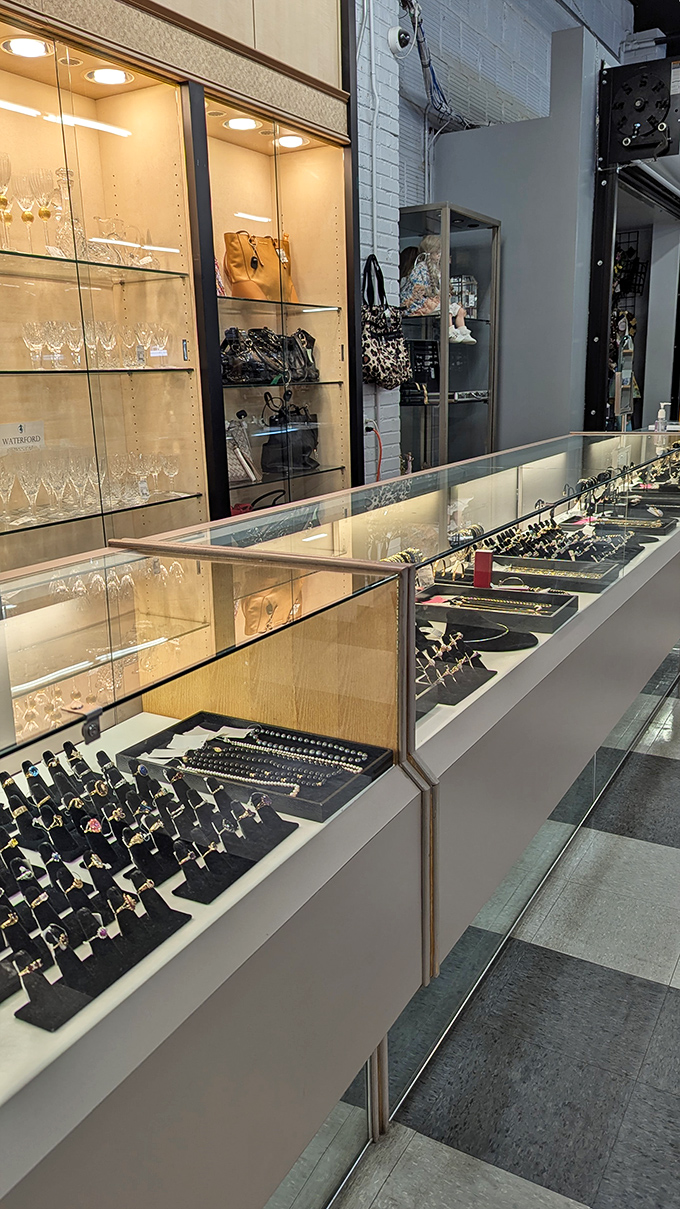 The jewelry display gleams under perfect lighting, tempting you to add "just one more" piece to your collection.