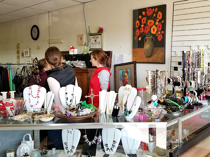 The jewelry counter gleams with possibilities, each necklace and bracelet holding stories from previous lives while ready to accessorize your next chapter.