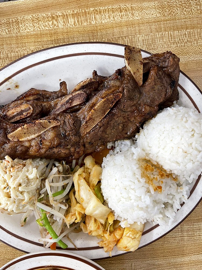 Kalbi ribs that don't need a fancy steakhouse setting. The meat-to-bone ratio here is the mathematical equation for happiness.