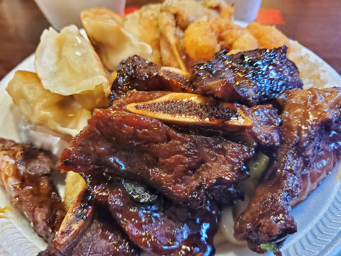 These kalbi ribs have that perfect lacquered glaze that makes you temporarily forget table manners exist. Napkins were invented for moments like this.