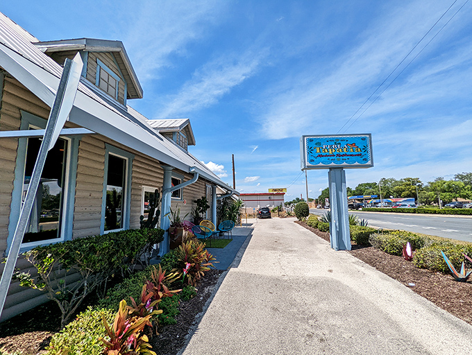 Tropical landscaping welcomes diners to this coastal-themed eatery where Florida casual meets culinary comfort.