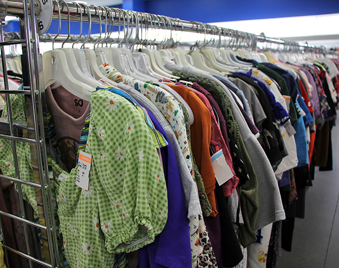 Color-coded clothing racks stretch endlessly, making wardrobe updates easier than parallel parking at the mall during holidays.