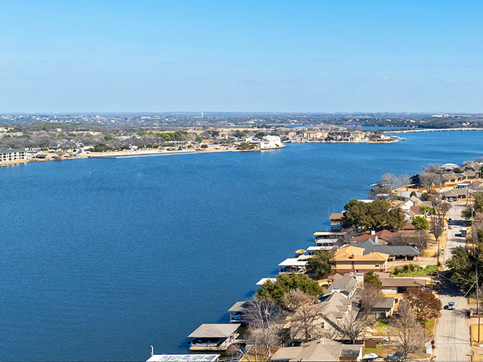 Lake Granbury stretches like a blue ribbon through the landscape, offering waterfront living that coastal retirees pay triple for without the hurricane insurance.