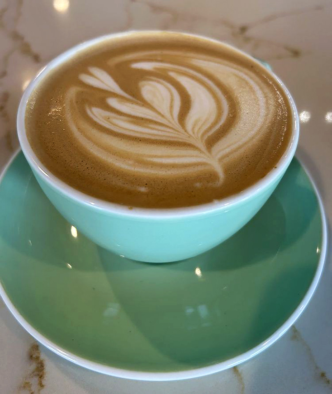 Latte art so pretty you almost don't want to drink it&mdash;almost. The turquoise cup adds that perfect Instagram-worthy pop of color.