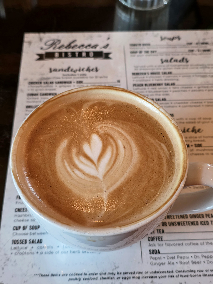 Coffee art this pretty almost makes you hesitate before drinking. Almost. The latte beckons with promises of caffeinated bliss.