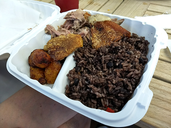Classic Cuban comfort on display: roasted pork, black beans, and those caramelized plantains that taste like banana's sophisticated cousin.