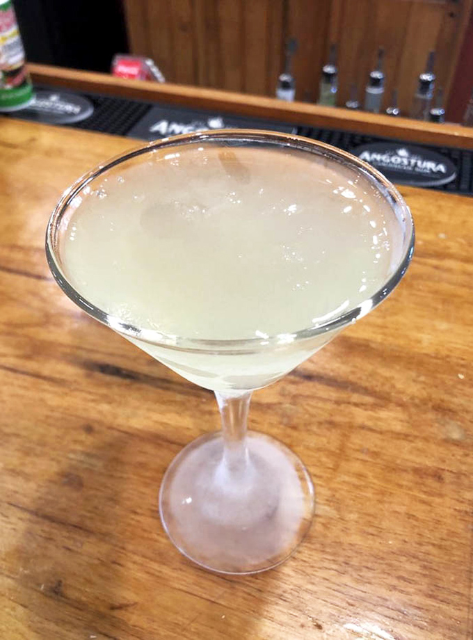 This lemon drop martini isn't just a drink&mdash;it's liquid sunshine that cuts through rich seafood like a well-timed punchline.