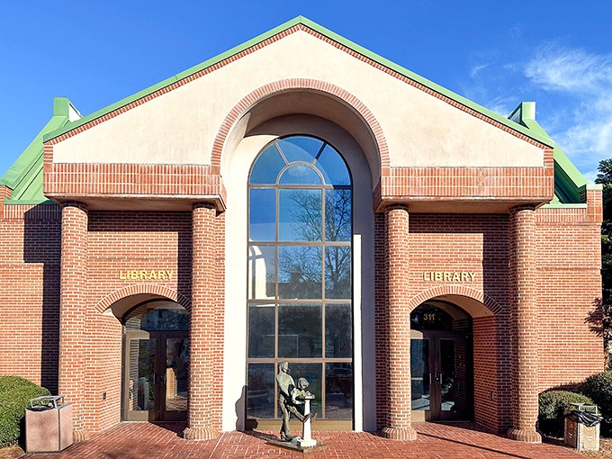 The library's dramatic arched window invites both bookworms and architecture buffs to step inside and lose track of time.